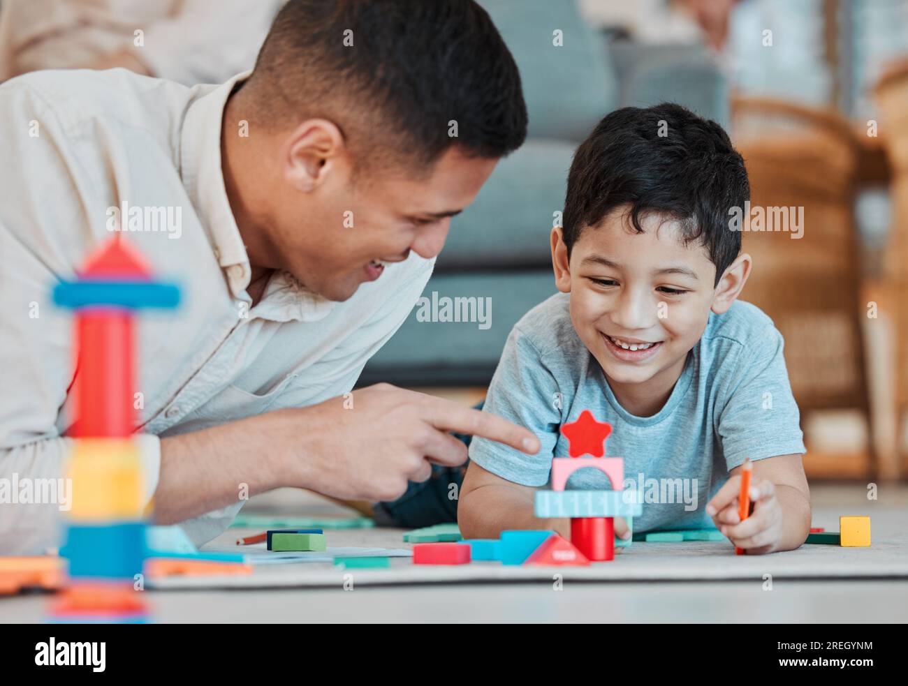 Dad, child and toys, playing on floor of living room and bonding with ... Dad, child and toys, playing on floor of living room and bonding with ...