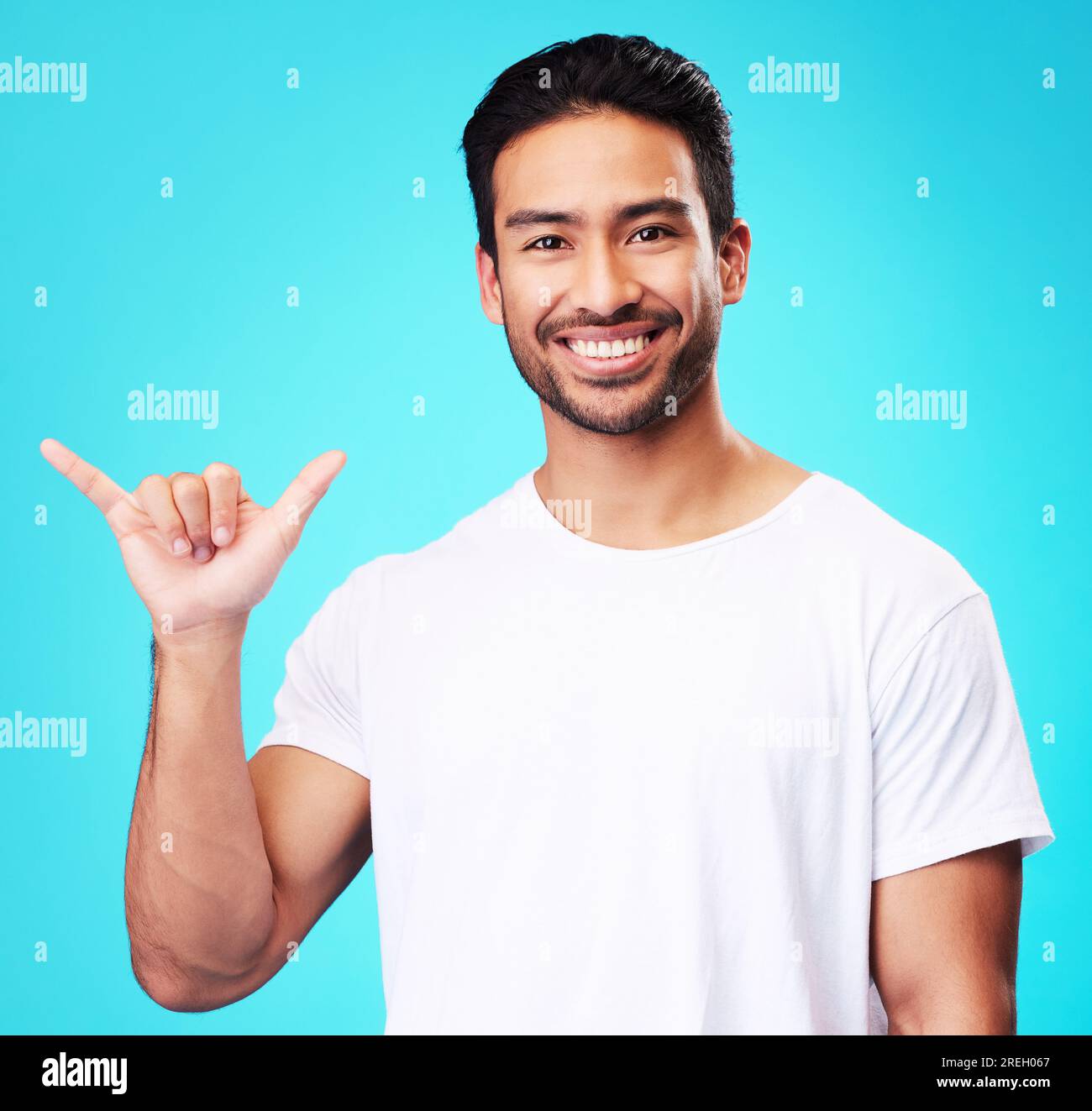 Man, smile and shaka in studio portrait with sign language, icon and ...
