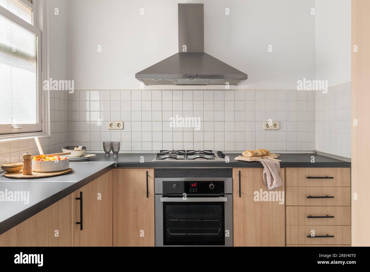 Modern kitchen with gas stove, cabinets, and appliances Stock Photo - Alamy