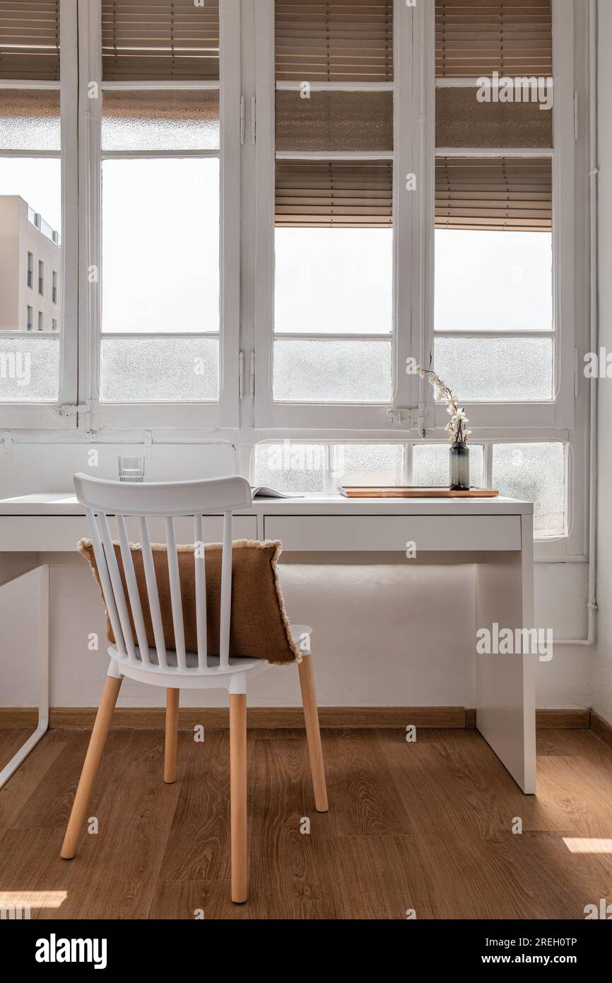 Sunny corner for work: Home office with wood furniture and window view ...