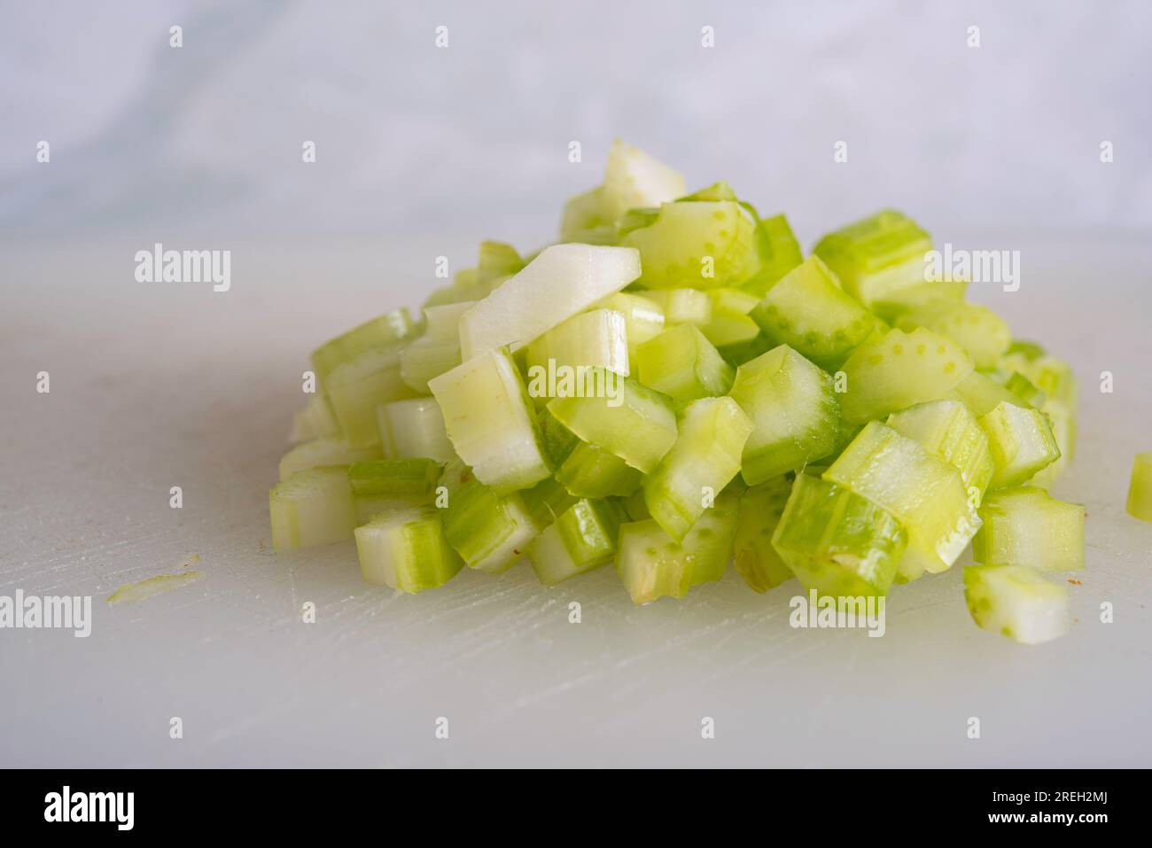 Green celery being sliced hi-res stock photography and images - Alamy