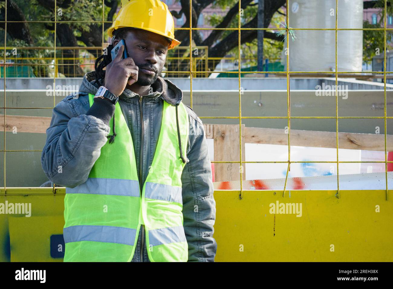 African ethnicity man with beard, disappointed construction worker ...