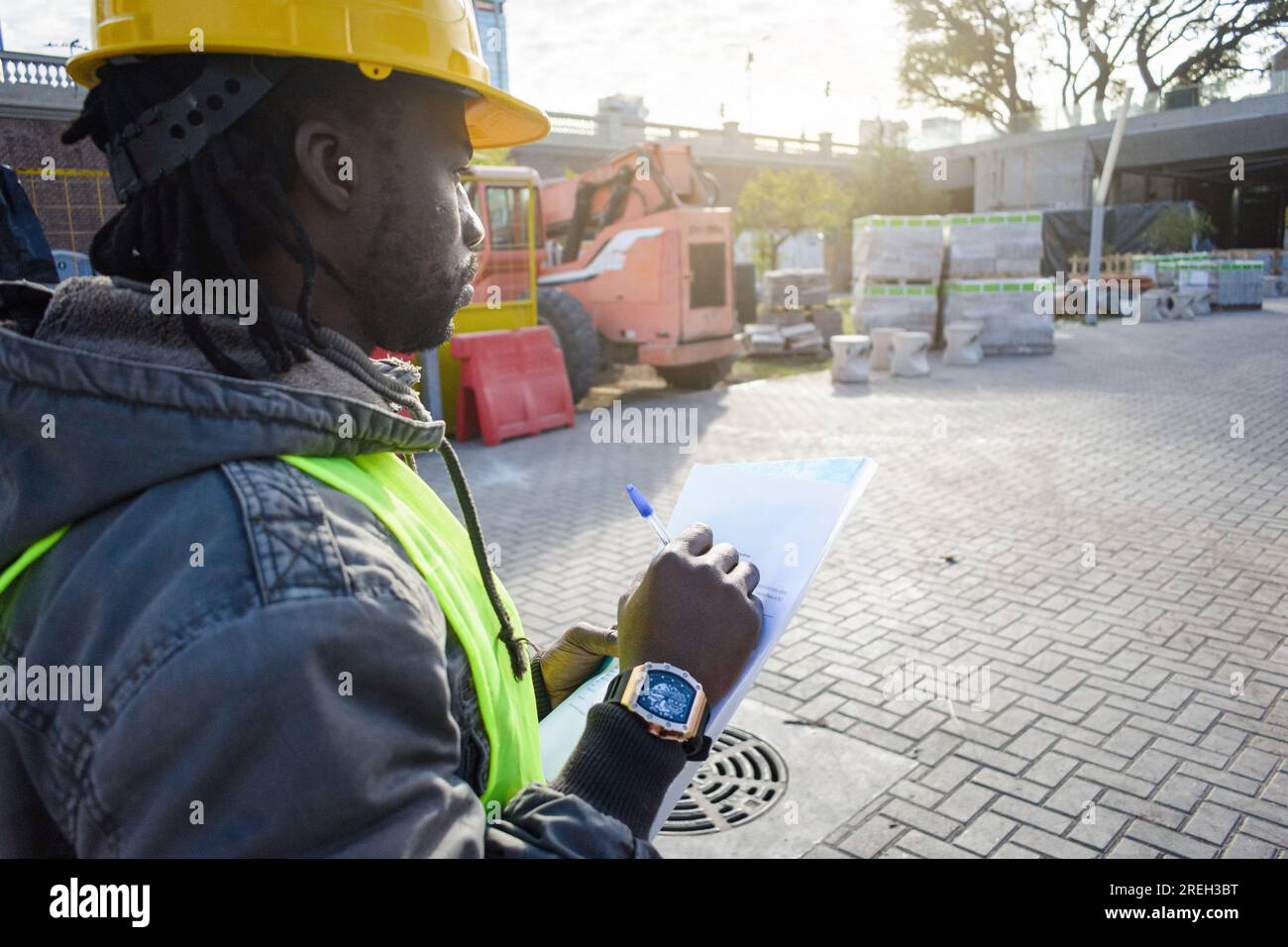 black male engineer supervisor, wearing safety helmet and reflective ...