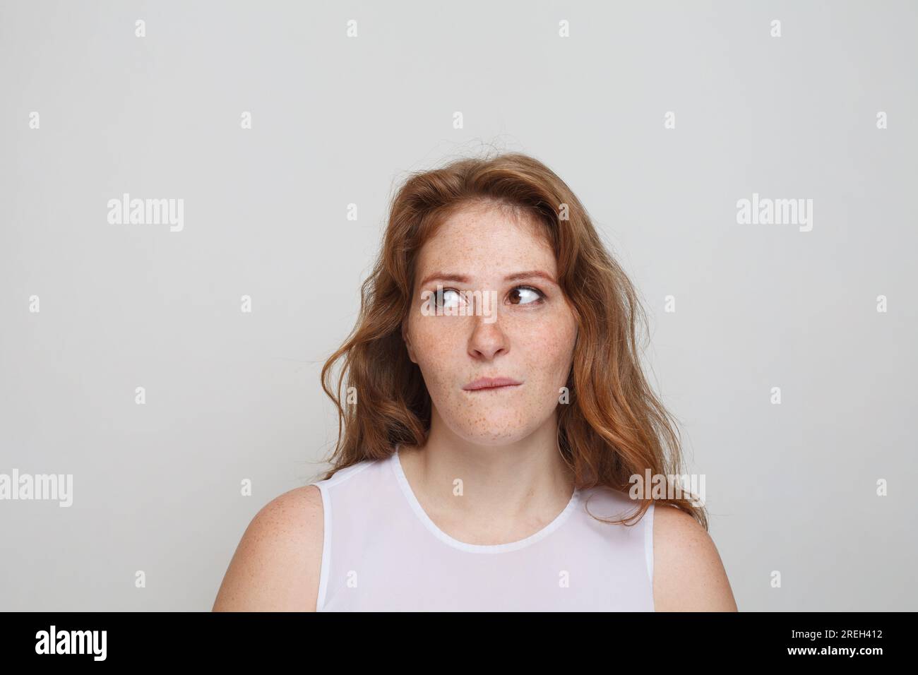 Thinking woman on white background. Doubt and idea concept Stock Photo ...