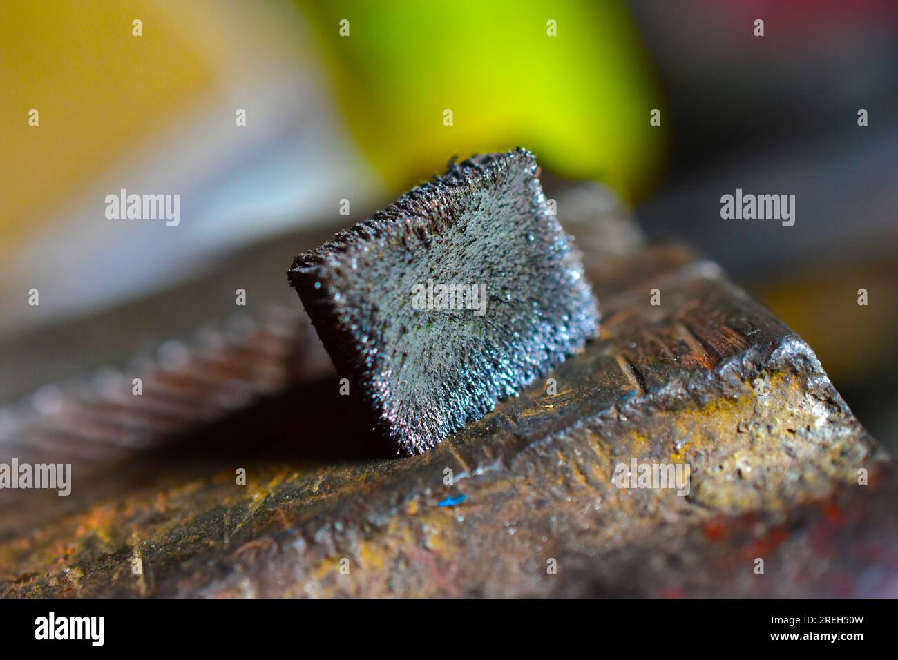 Metal magnet in the iron crumb in the hands Stock Photo - Alamy
