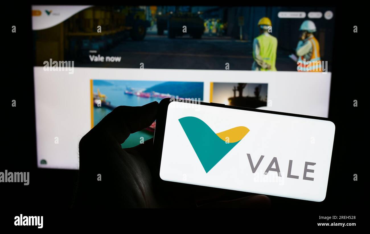 Person holding cellphone with logo of Brazilian mining company Vale S.A ...