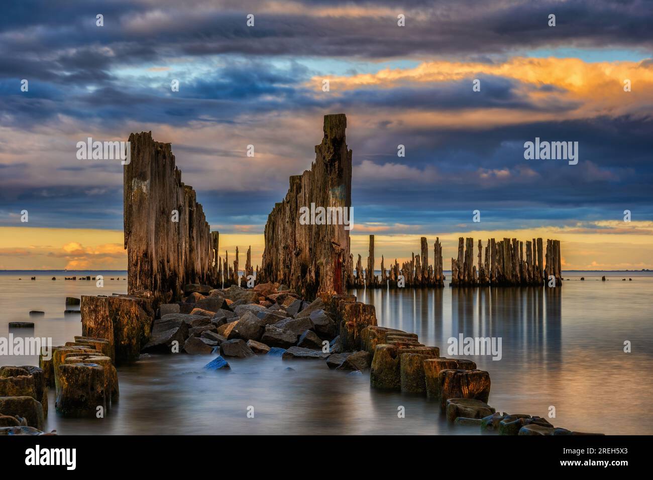 Wooden posts of an old pier on the Baltic Sea in Gdynia, Poland ...