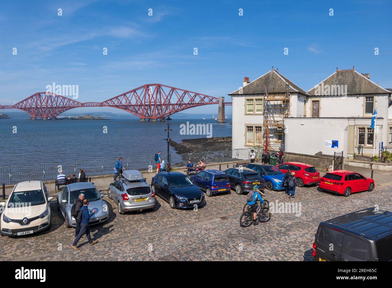Cars in parking lot with view to Forth Bridge in South Queensferry town ...