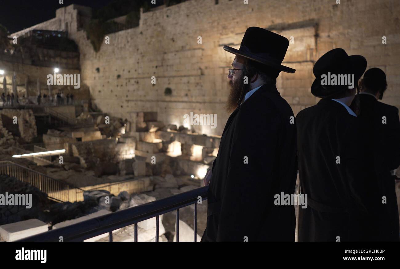 Haredi Jews stand over ruins at the southwestern corner of the Temple ...