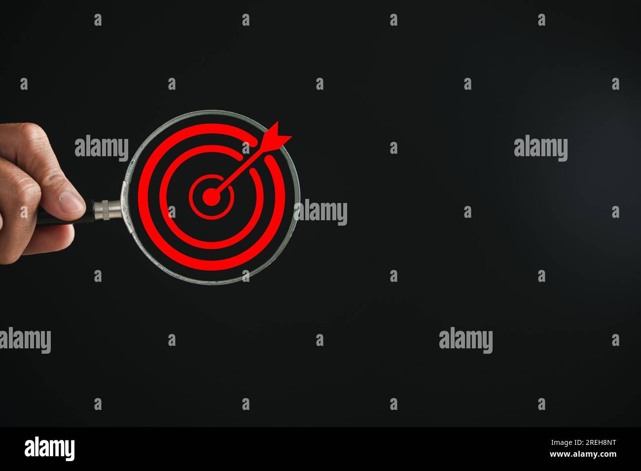 Target board inside magnifier glass for focus business objective Stock ...