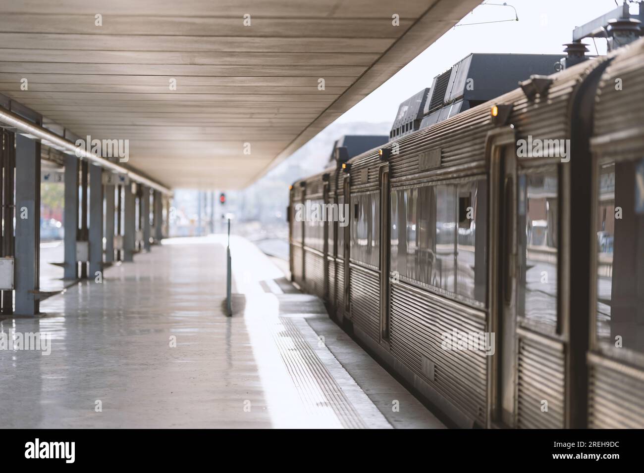 The train stands at a deserted open station. Mid shot Stock Photo - Alamy