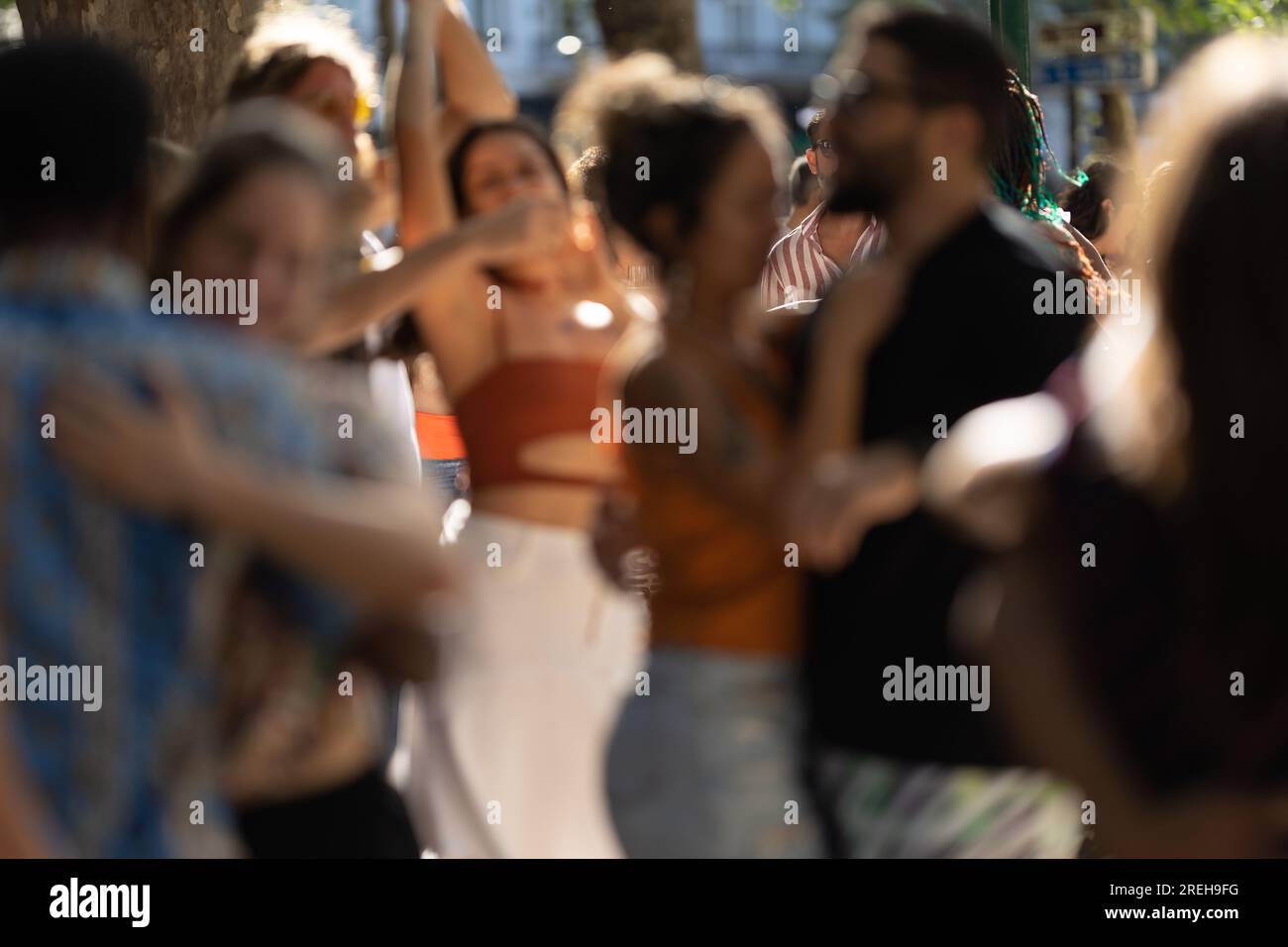 Cheerful people dancing bachata on the street. Mid shot Stock Photo - Alamy