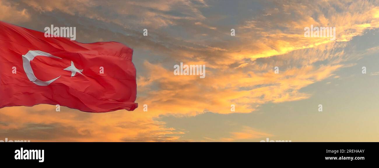 Turkish flag on cloudy sunset sky background. Happy National holiday of ...