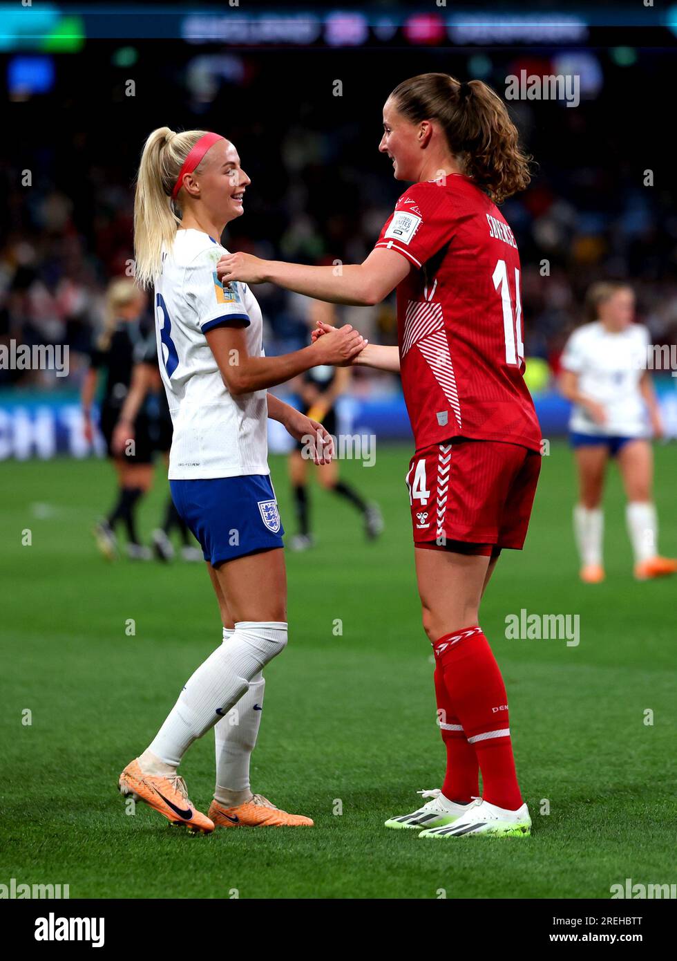 England's Chloe Kelly (left) speaks to Denmark's Nicoline Sorensen at ...