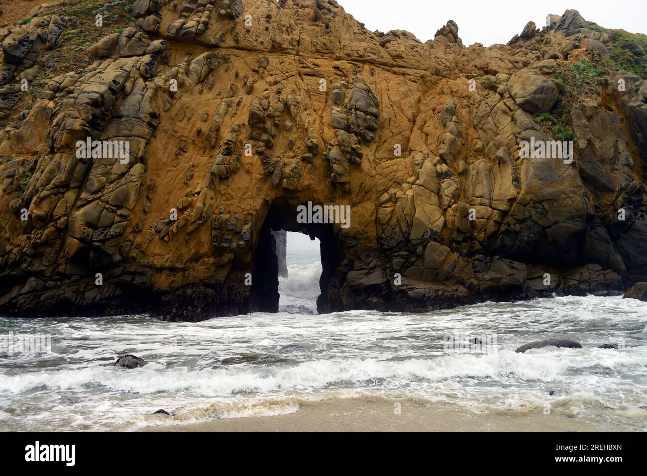 Keyhole Arch at Pfeiffer Beach on a foggy day Stock Photo - Alamy