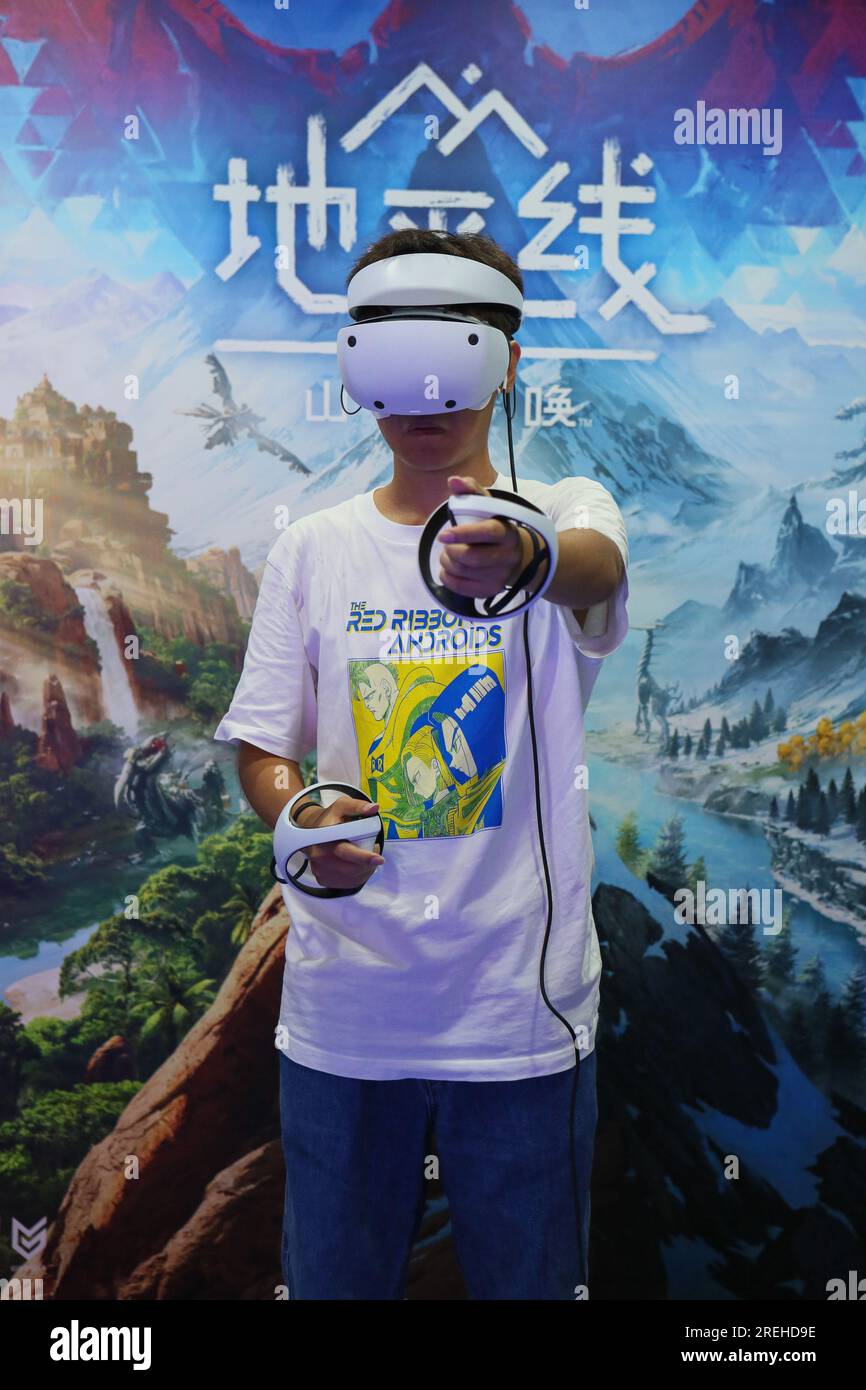 Shanghai, China. 28th July, 2023. A visitor experiences a VR game ...