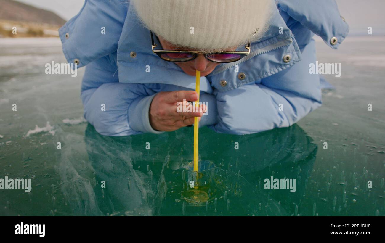 Siberia tradition cocktail Kiss of Baikal is entertainment for tourist on Lake Baikal. Russian ...