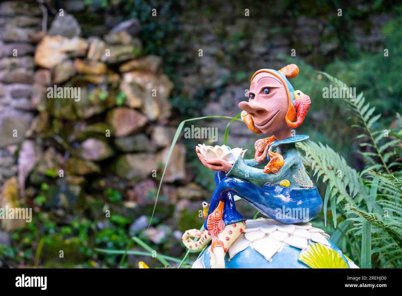 Colorfully painted ceramic elf in the Elf Yard. Valley of Arts Festival ...