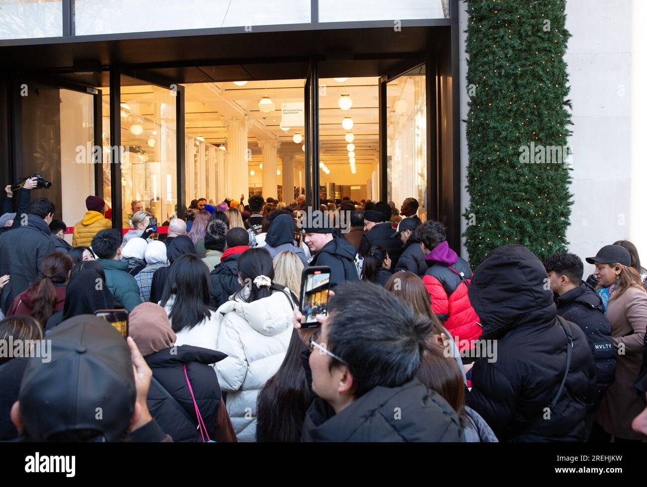 People enter Selfridges store on Oxford Street in London, at the ...