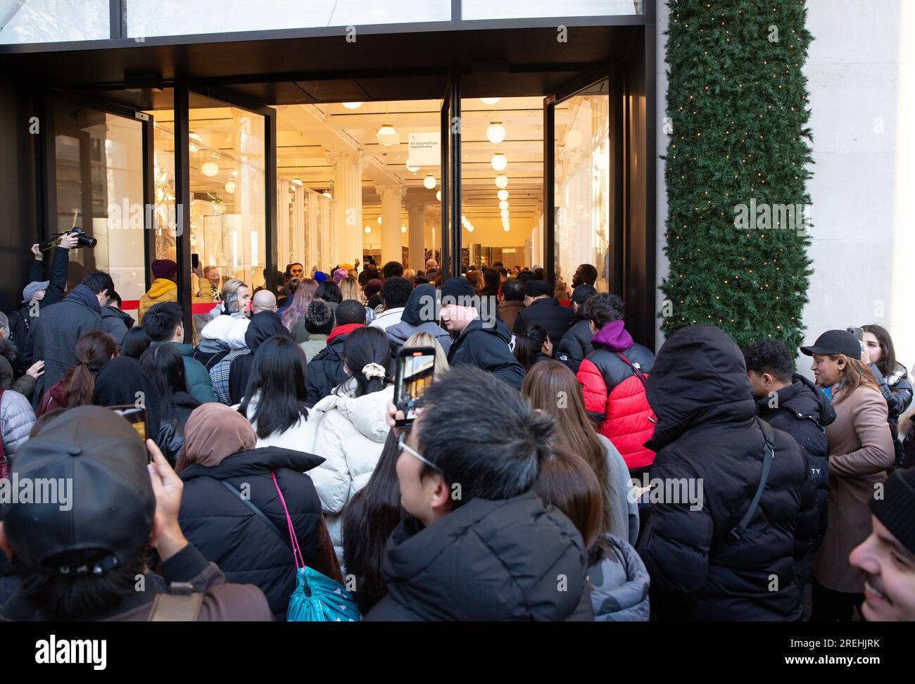 People enter Selfridges store on Oxford Street in London, at the ...