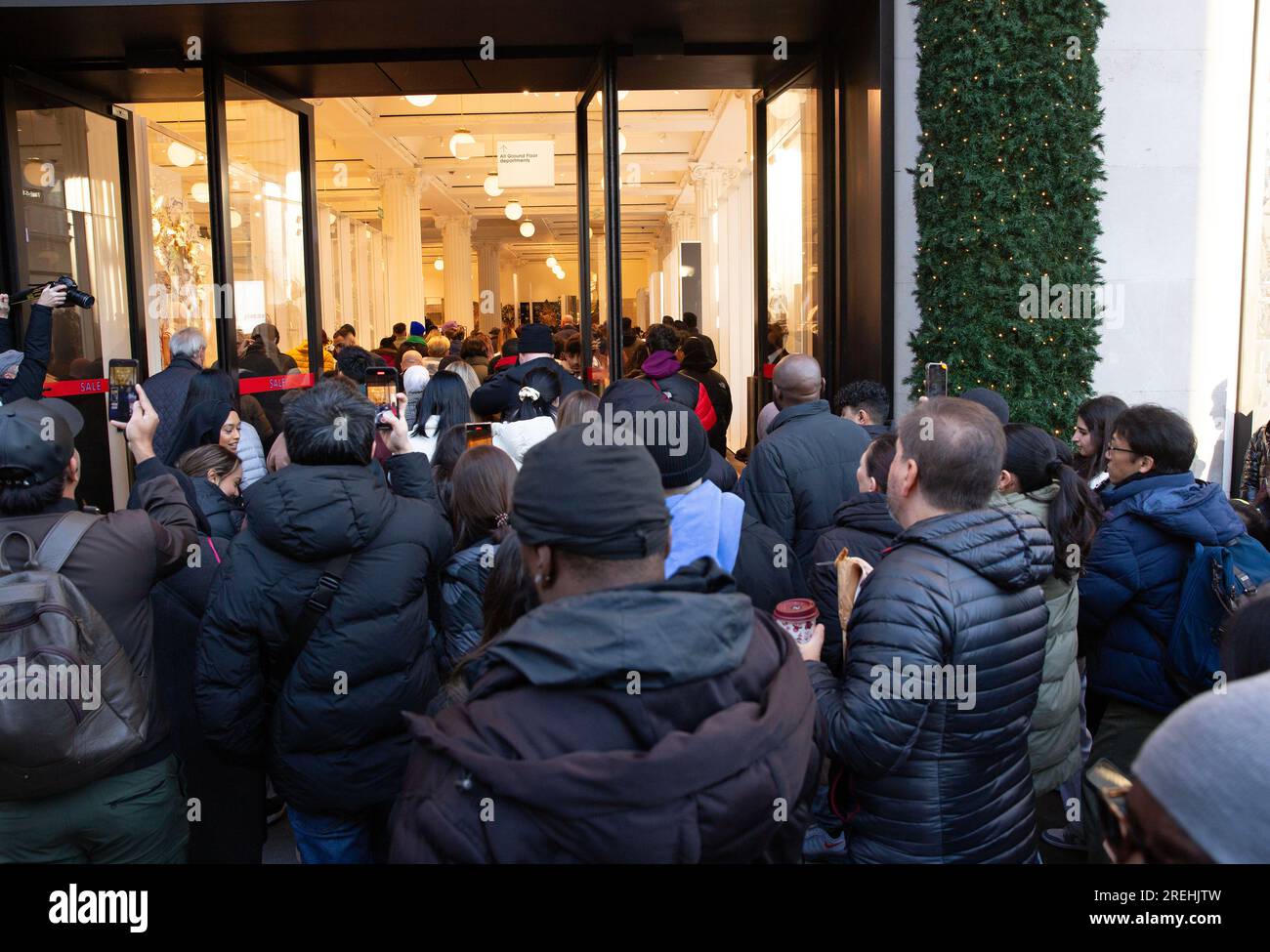 People enter Selfridges store on Oxford Street in London, at the ...