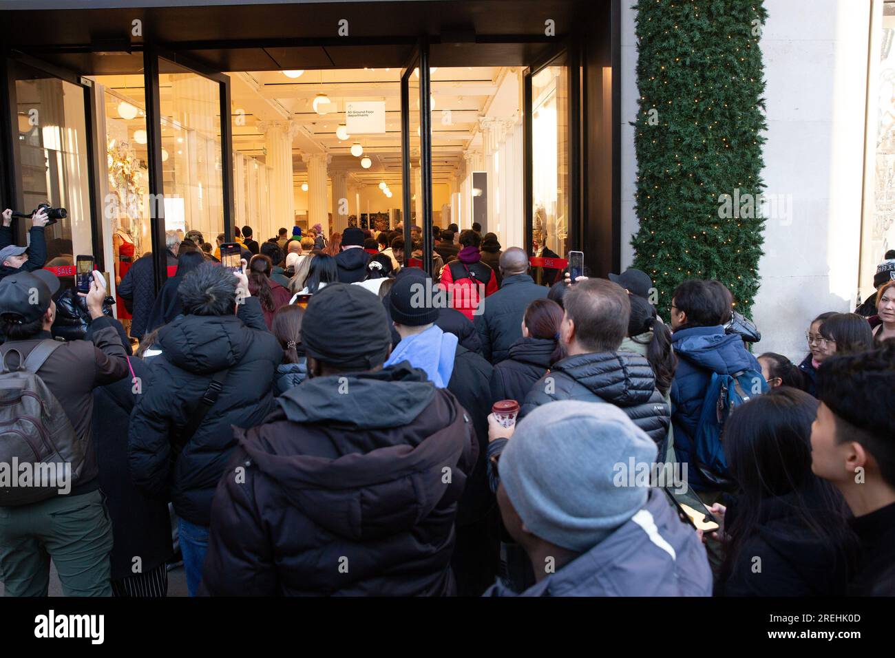 People enter Selfridges store on Oxford Street in London, at the ...