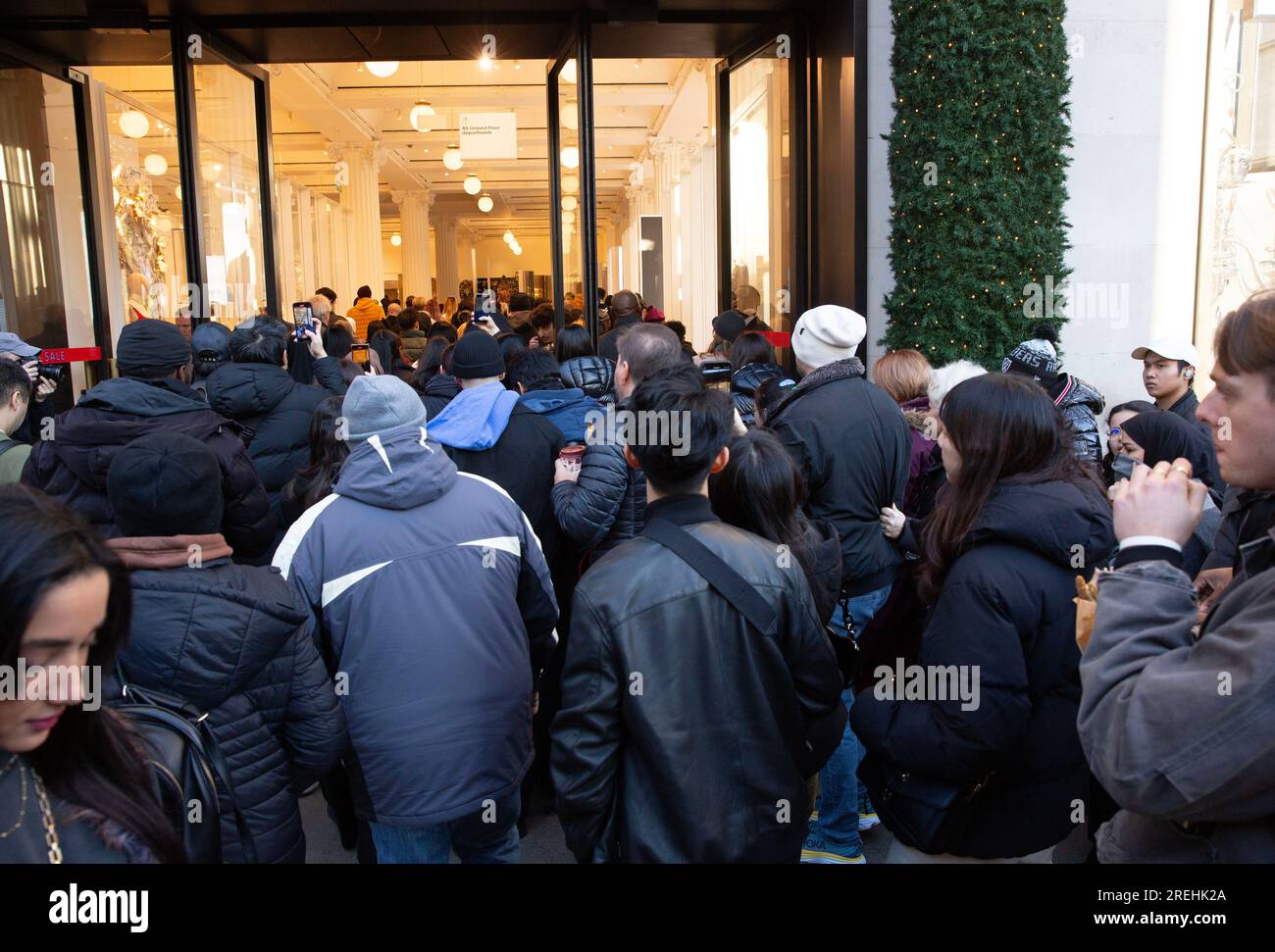 People enter Selfridges store on Oxford Street in London, at the ...