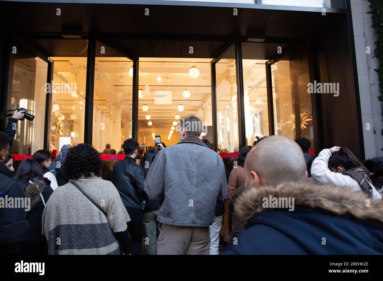 People enter Selfridges store on Oxford Street in London, at the ...