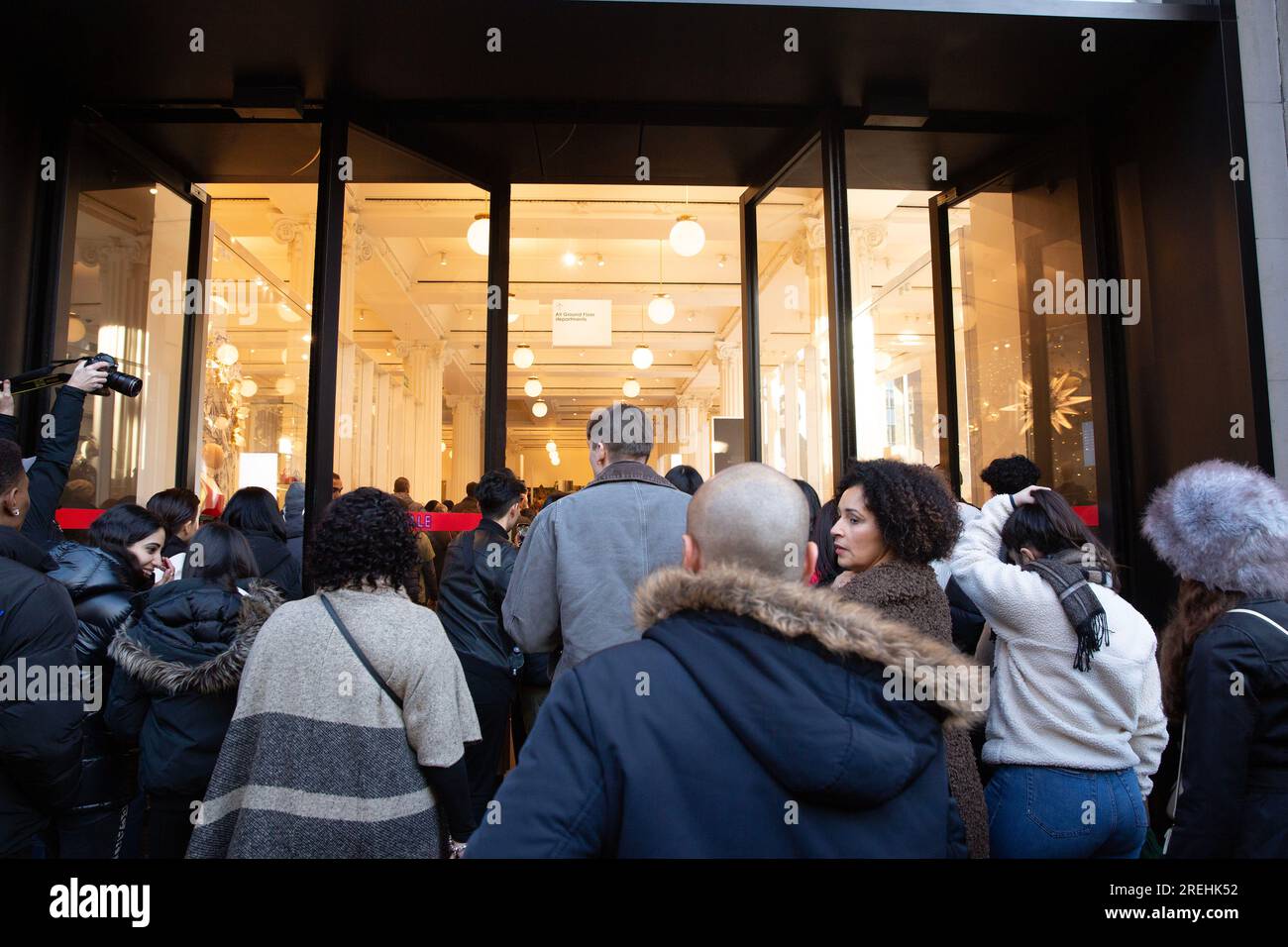 People enter Selfridges store on Oxford Street in London, at the ...