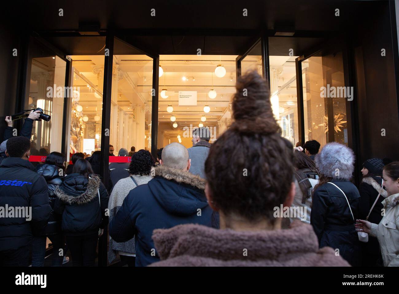 People enter Selfridges store on Oxford Street in London, at the ...
