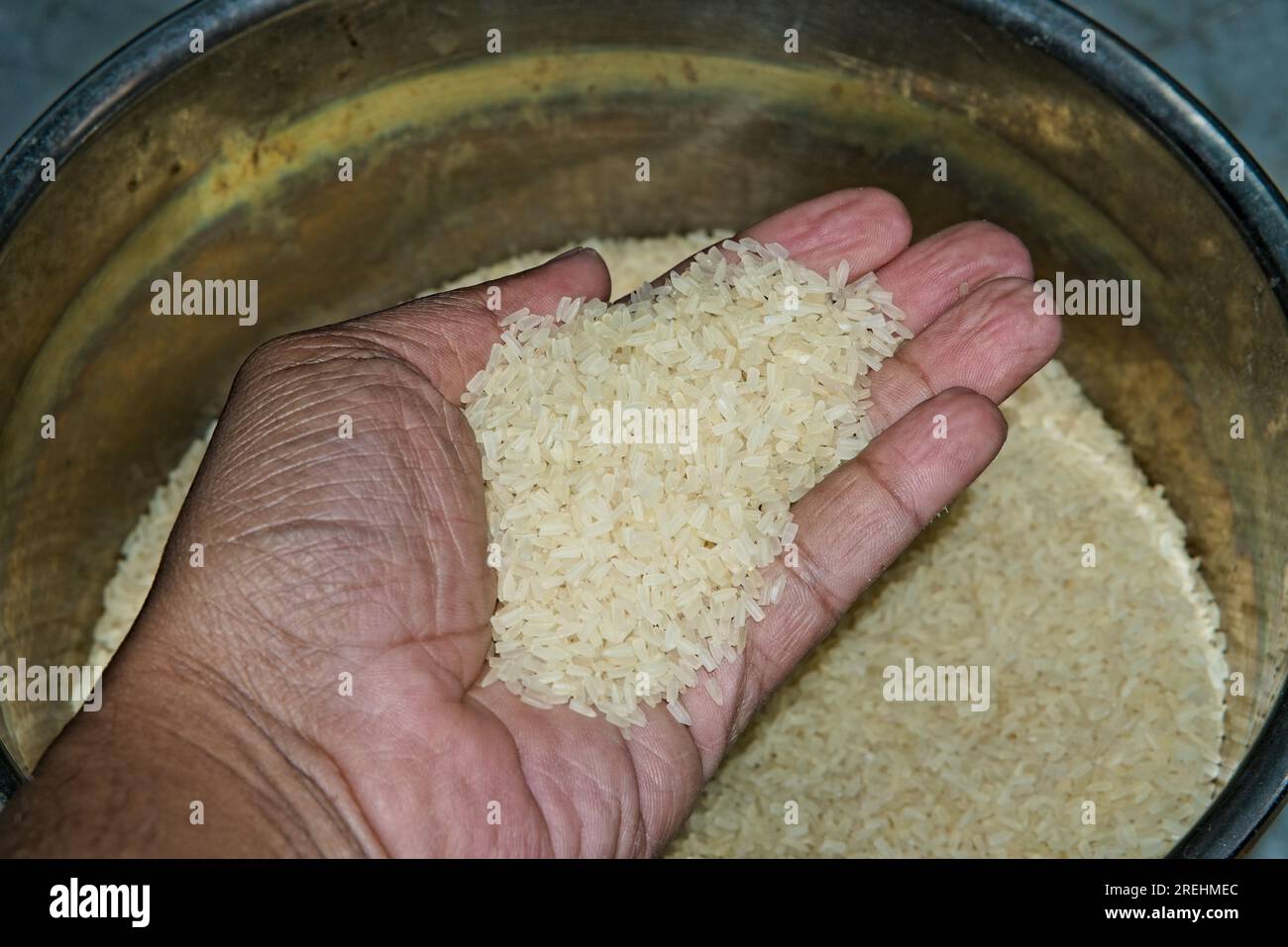 a handful of raw uncooked basmati rice Stock Photo - Alamy
