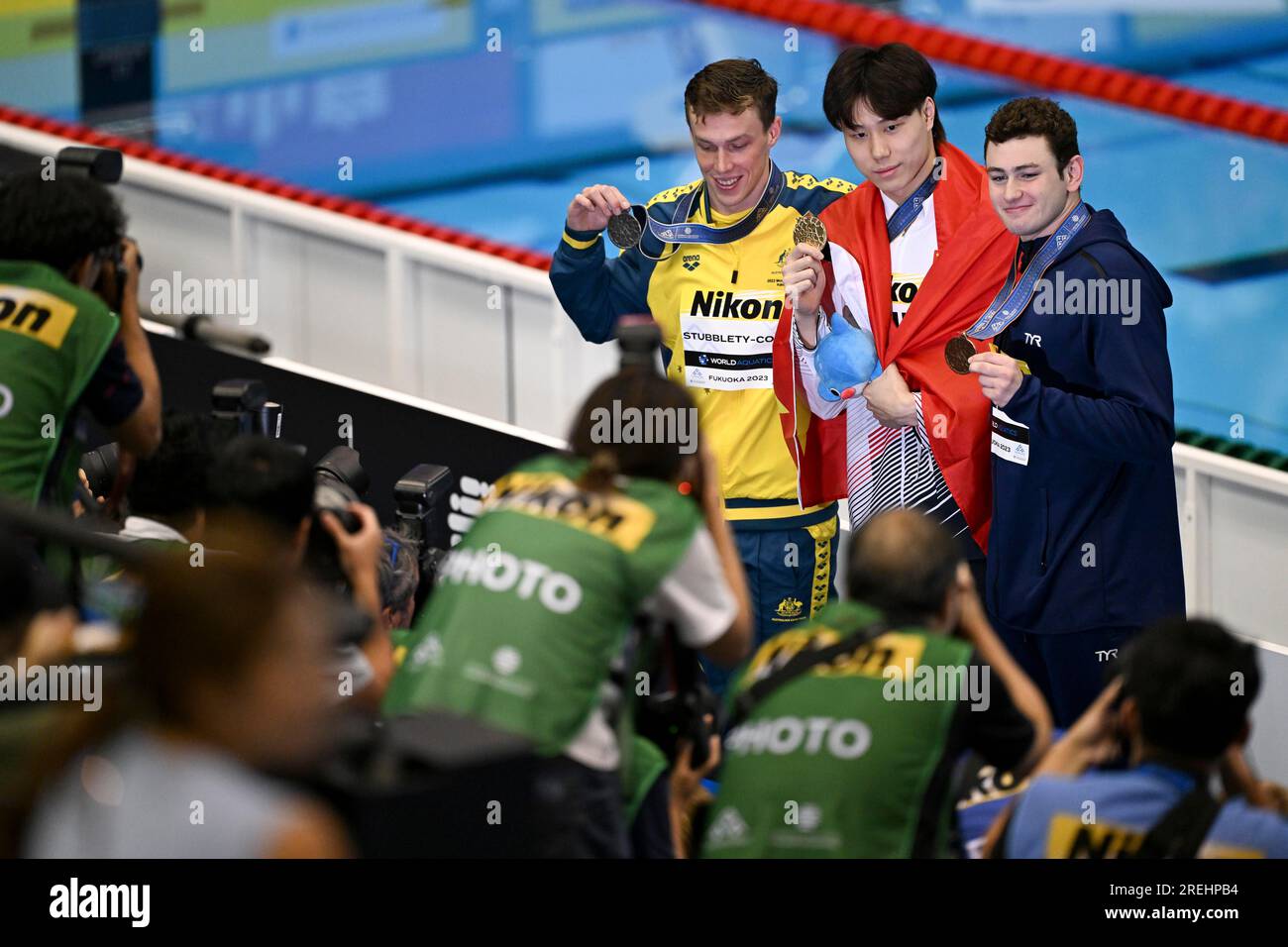 Fukuoka, Japan. 28th July, 2023. Gold medalist Qin Haiyang (C) of China ...