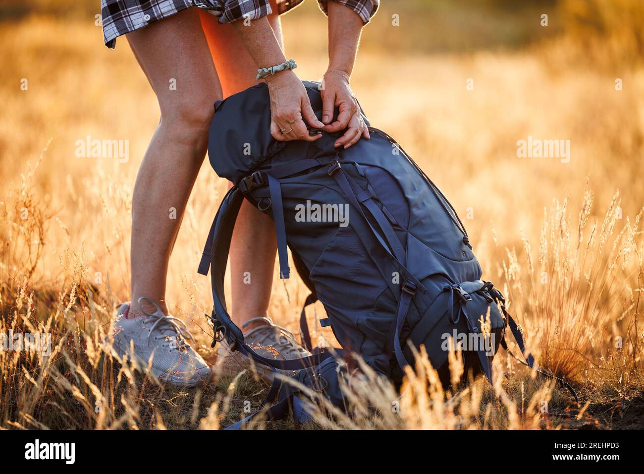 Hiker removing backpack hi-res stock photography and images - Alamy