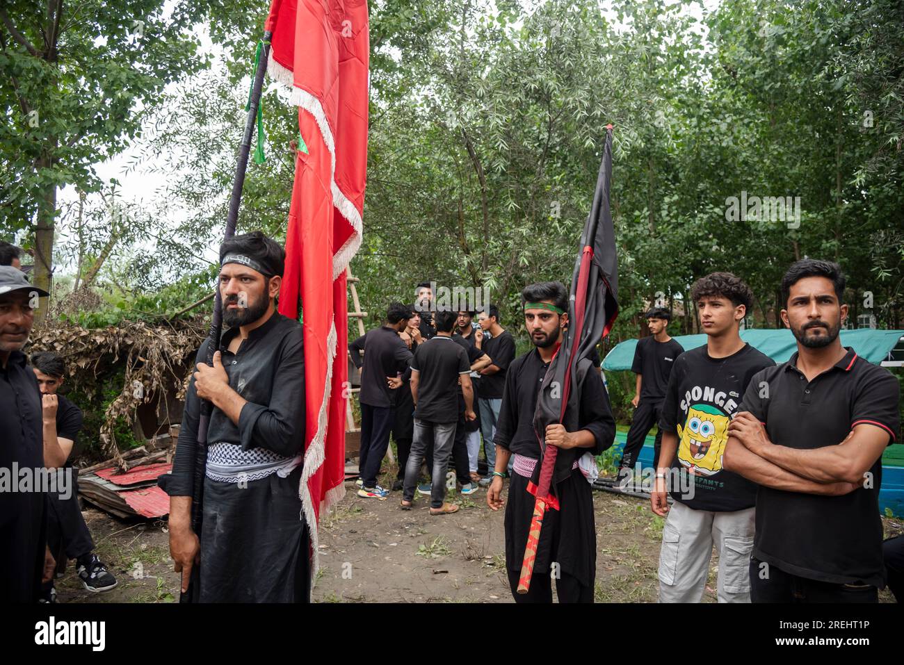 Srinagar, India. 28th July, 2023. Shia Muslims holding Alam's ...