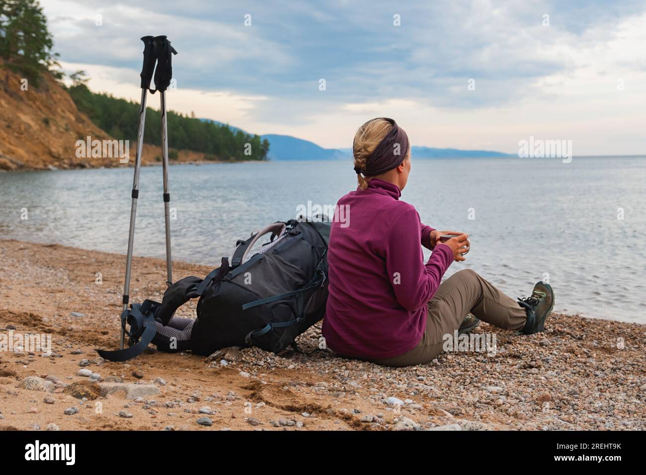 Hiking tourism adventure. Backpacker woman resting after hiking looking ...