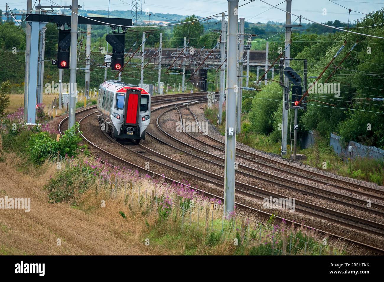 Transport for Wales Class 197 diesel commuter train swinging through ...