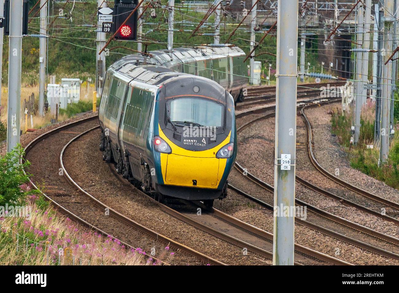 Avanti Pendolino tilting electric train swinging through curve in the ...