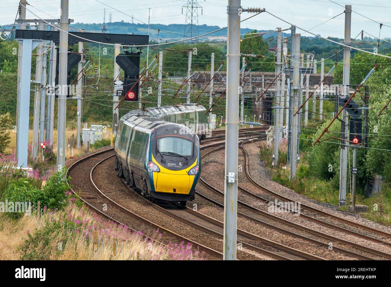 Avanti Pendolino tilting electric train swinging through curve in the ...