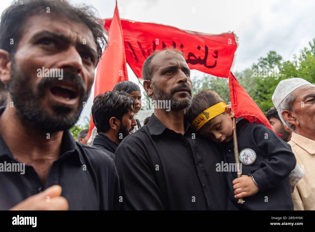 Shia Muslims participate in an Ashura procession. Muharram is the first ...