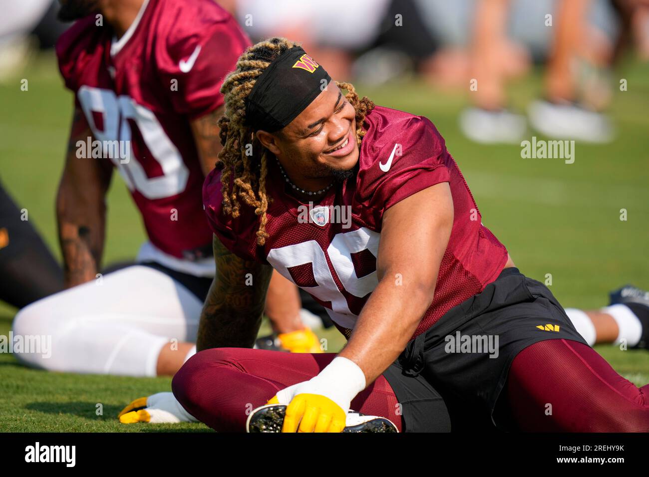 Washington Commanders defensive end Chase Young stretches during a NFL ...