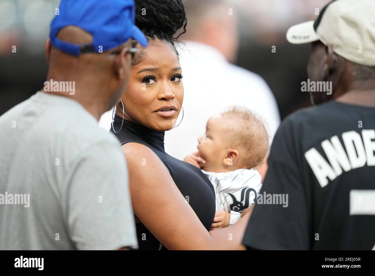 Actress Keke Palmer holds her son, Leodis "Leo" Andrellton Jackson before throwing out a ...