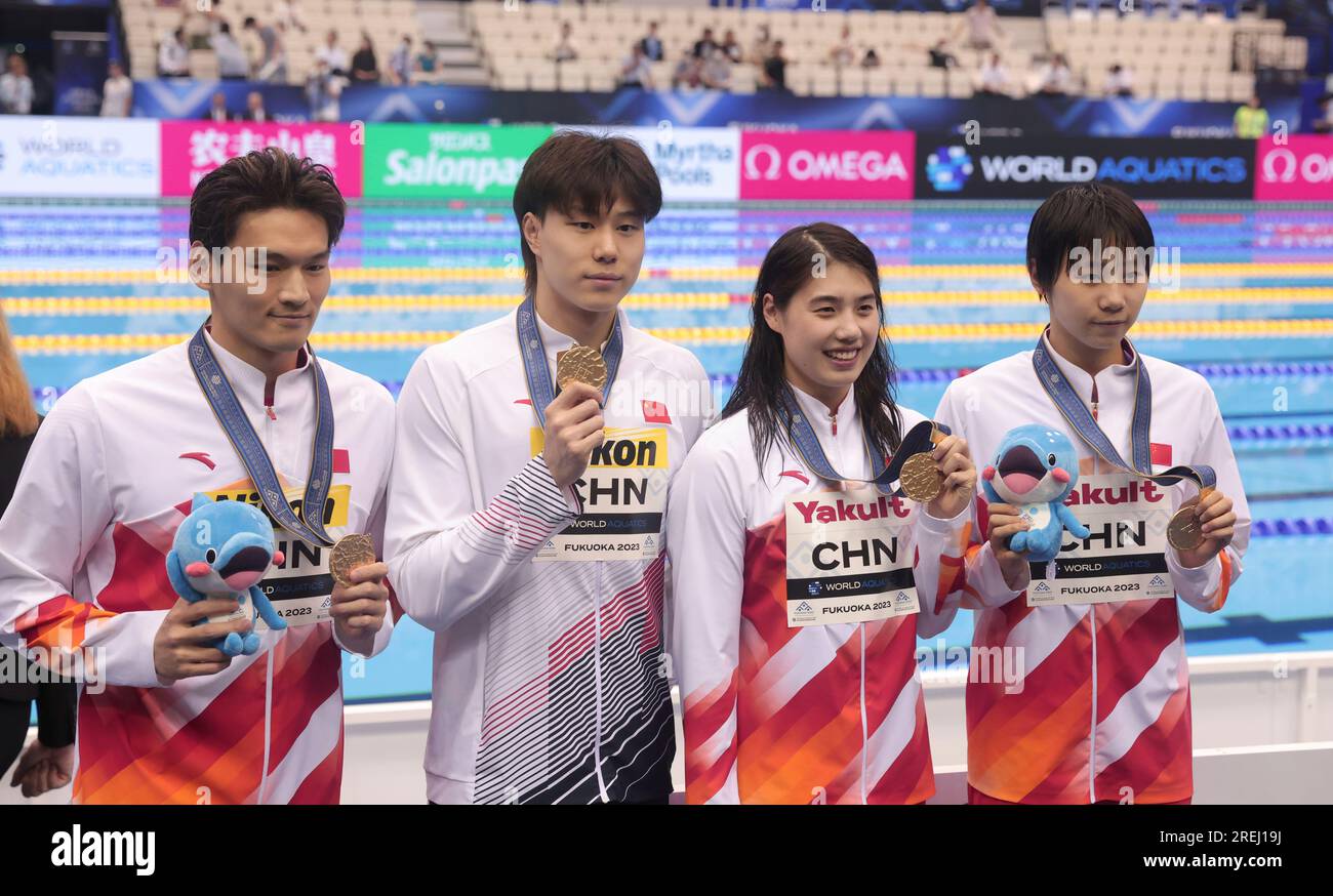 China's team members celebragte during the award ceremony of the Mixed 4x100 medley in World ...