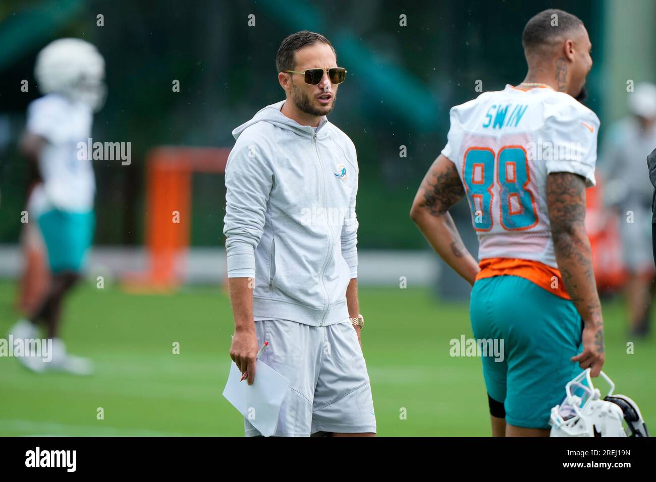 Miami Dolphins head coach Mike McDaniel watches practice at the NFL football team's training ...
