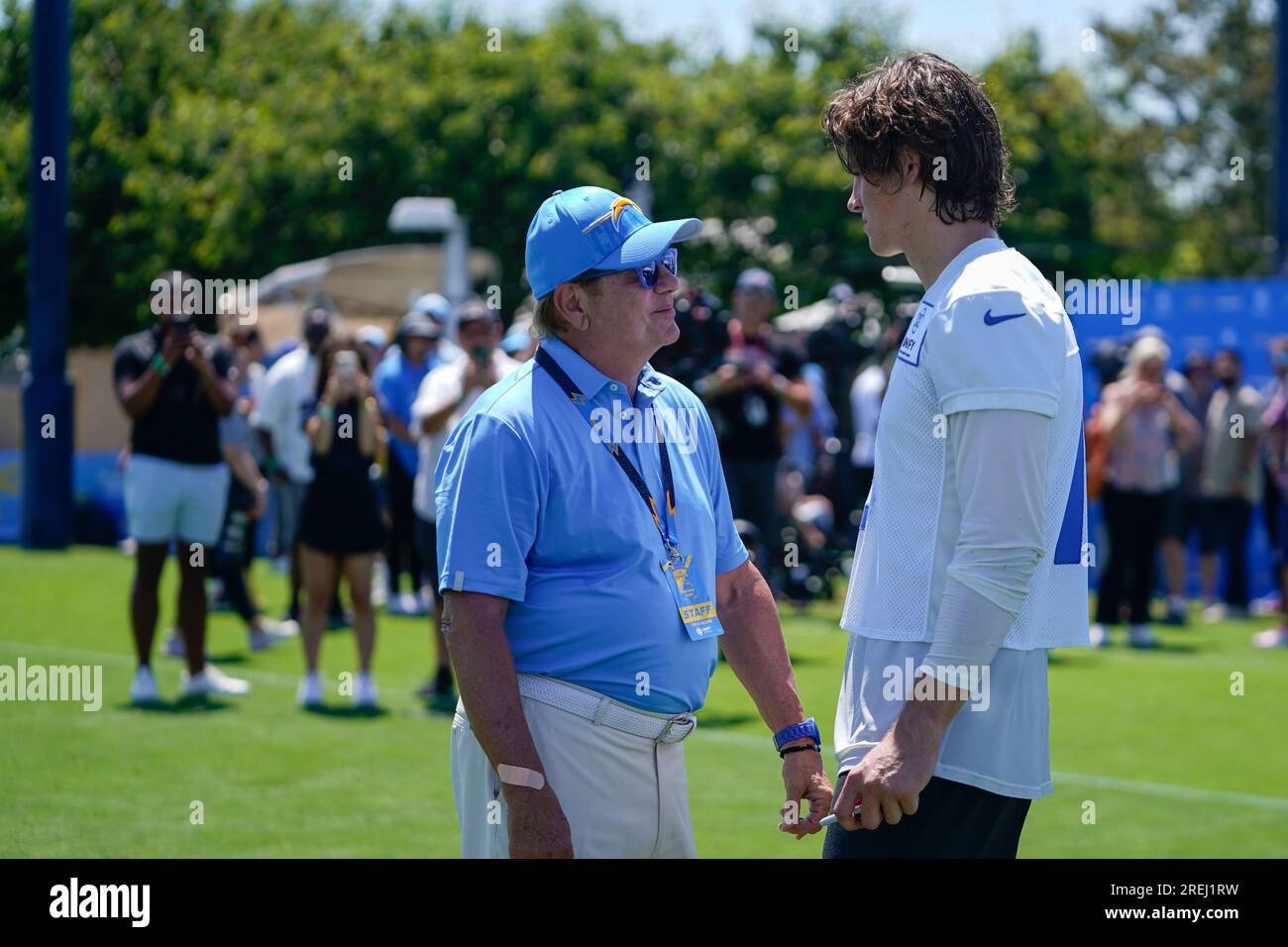 Los Angeles Chargers owner Dean Spanos speaks with quarterback Justin ...