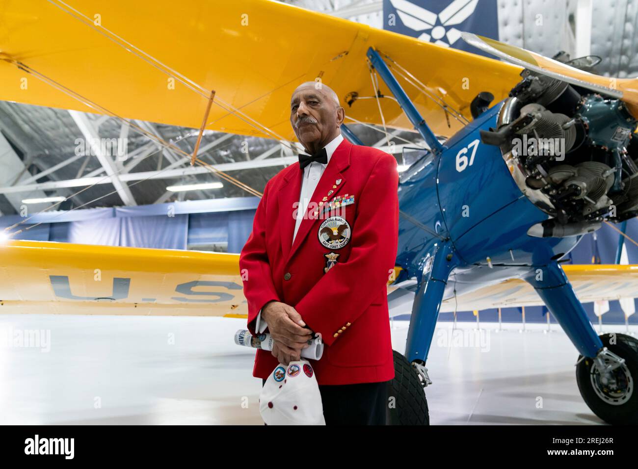 Retired Lt. Col. Shelton Ivan Ware stands near the PT-17 Stearman ...