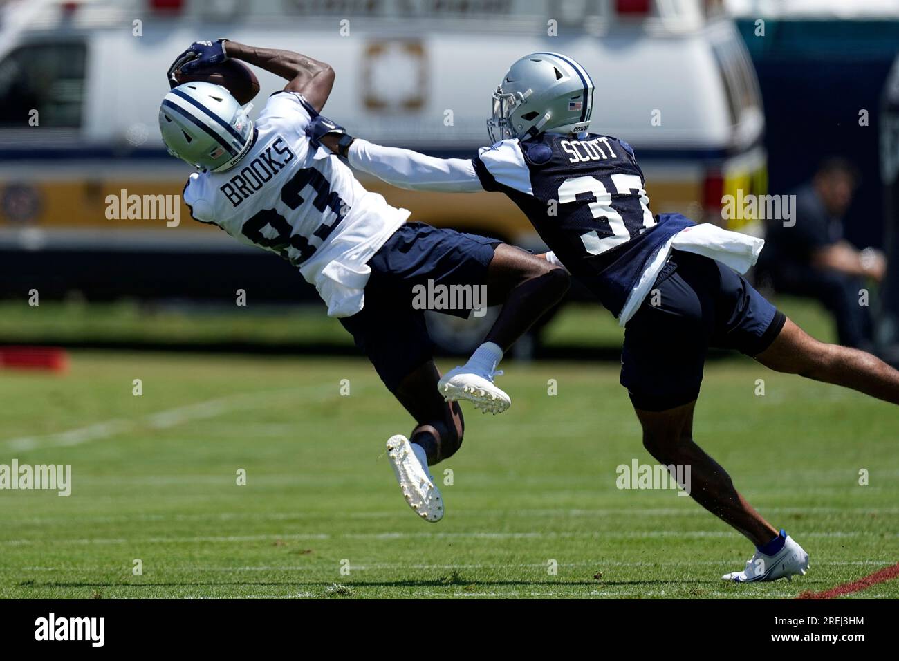 Dallas Cowboys wide receiver Jalen Brooks, left, catches a pass as ...