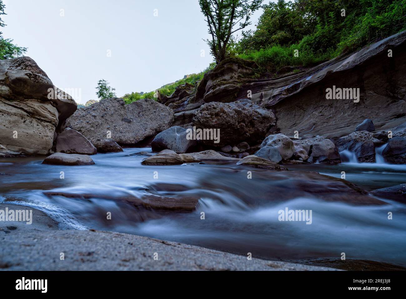 waterfall long exposure view in canyon Stock Photo - Alamy
