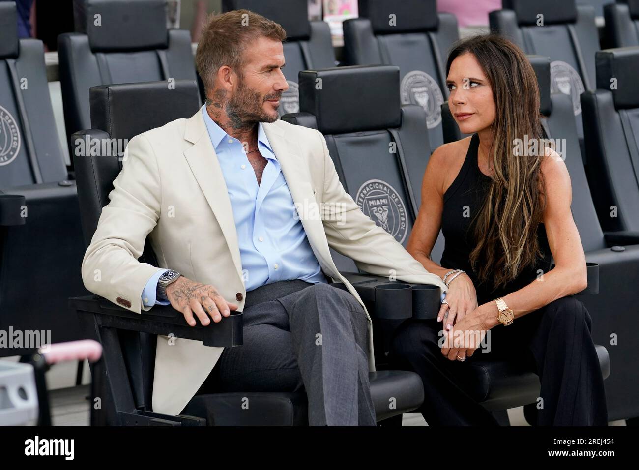 Inter Miami co-owner David Beckham, left, sits with his wife Victoria ...
