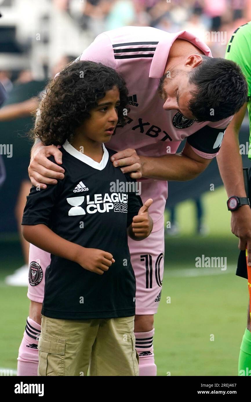 Inter Miami forward Lionel Messi stands with Asahd Khaled, the son of ...