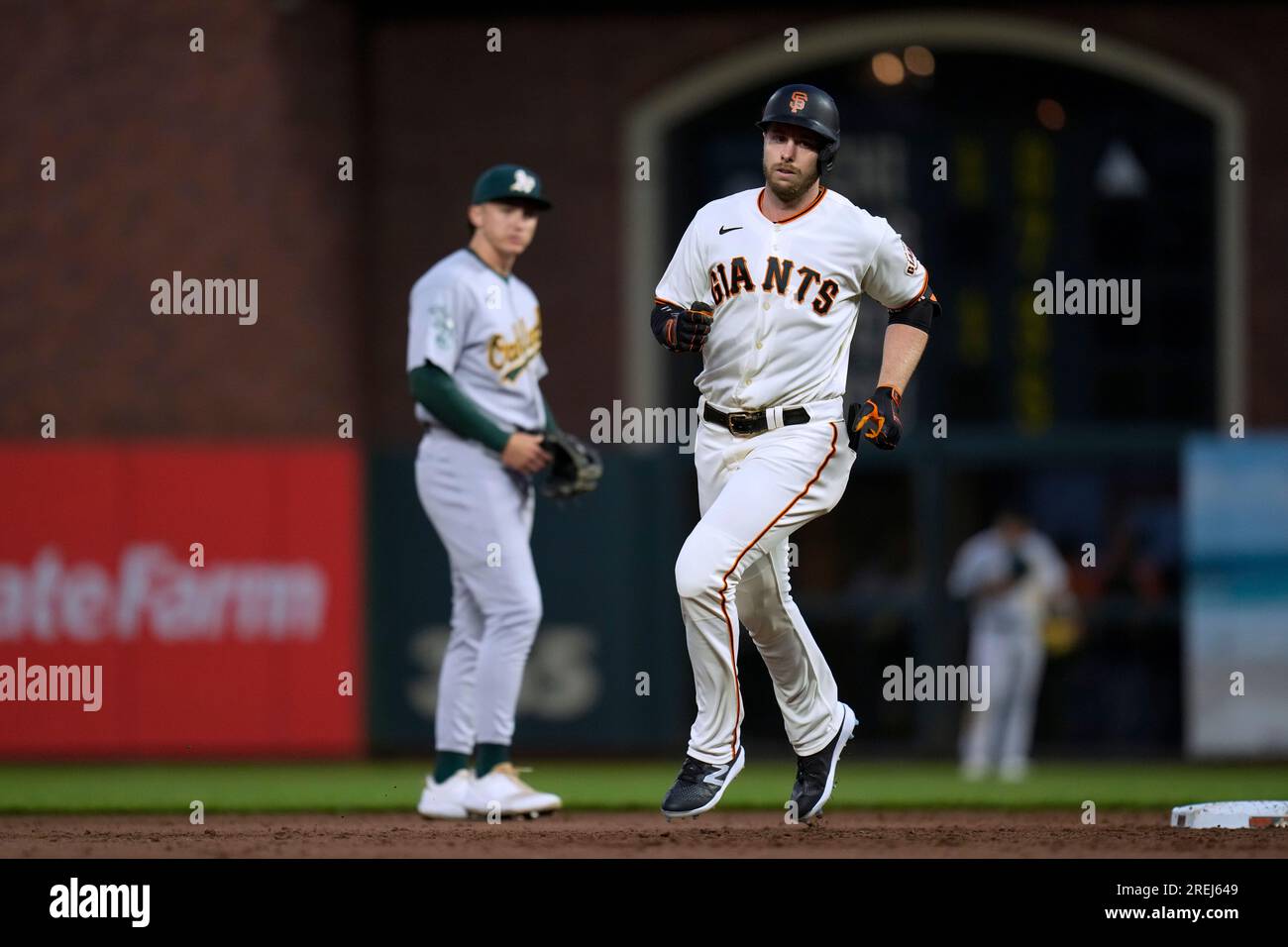 San Francisco Giants' Austin Slater, right, runs the bases after ...